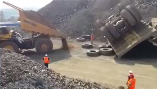Watch a front-facing excavator right a dump truck - MINING.COM