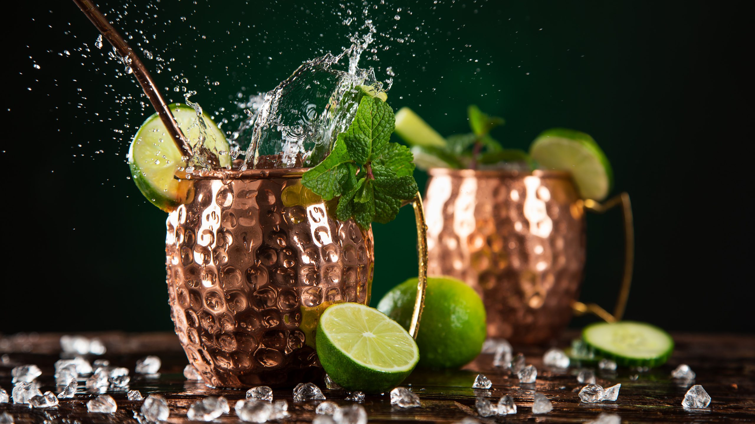 Famous splashing Moscow mule alcoholic cocktail in copper mugs ...