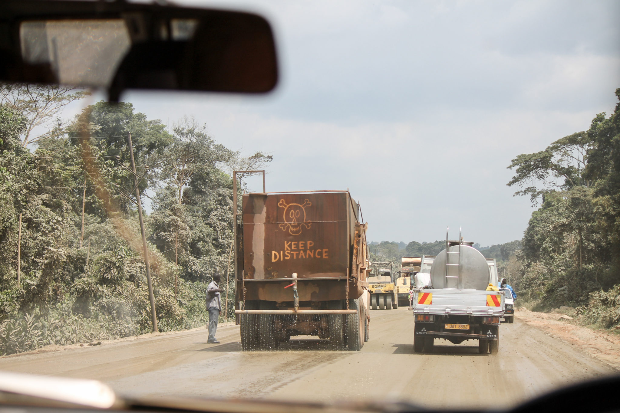 Large scale construction works on an African highway with primitive and dangerous equipment ...