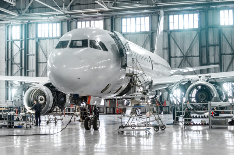 Passenger aircraft on maintenance of engine and fuselage repair in ...