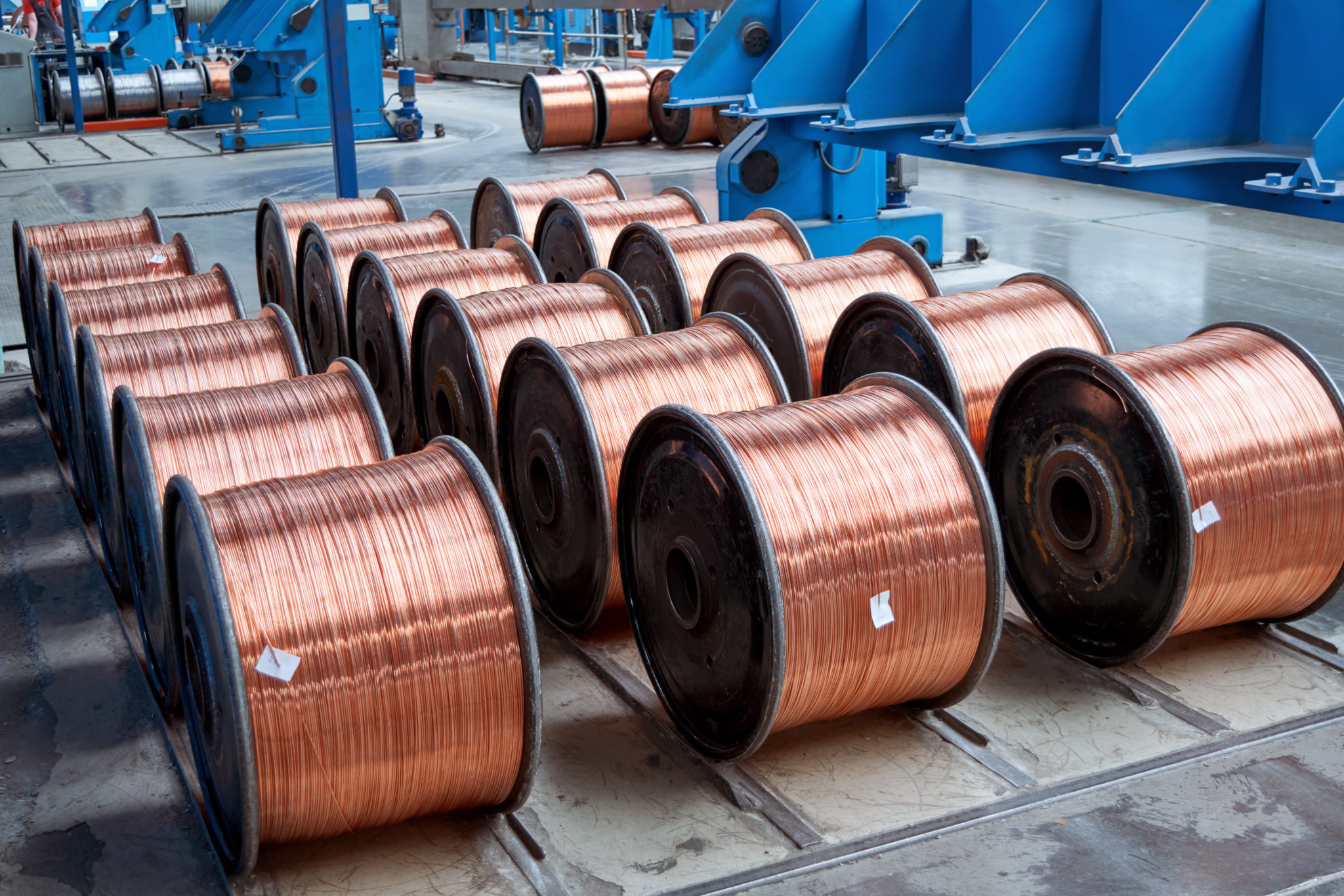 Several rows of finished coils with copper wire in production. - MINING.COM